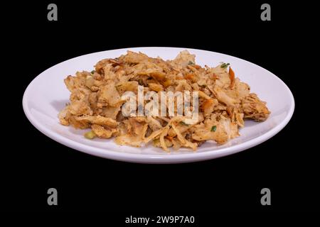Sri Lankan kottu roti on a white plate against a black background Stock ...