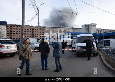 Kyiv, Ukraine. 29th Dec, 2023. People walk past the debris lying in the ...