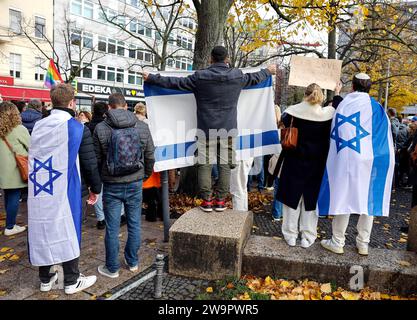 Participants in the march in solidarity with Israel display placards ...