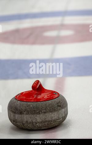 Curling rocks on ice Stock Photo - Alamy