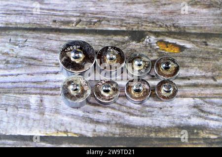 Laboratory weights and masses, used to calibrate scales or balances or ...