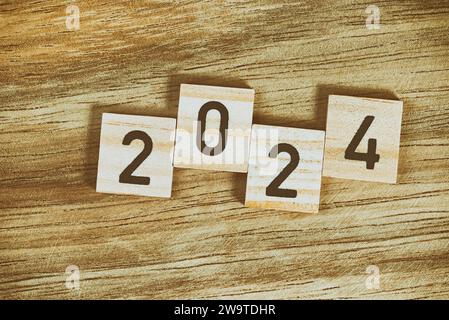 The year 2024 on wooden letters Stock Photo - Alamy