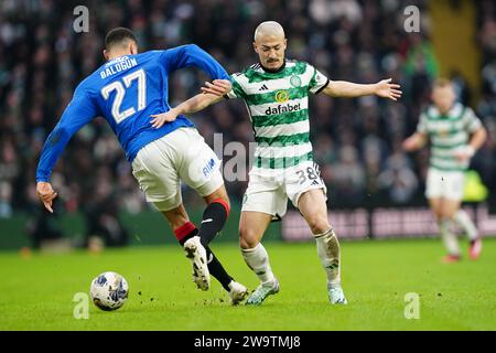 Celtic's Daizen Maeda (left) and Rangers' Mohammed Diomande battle for ...