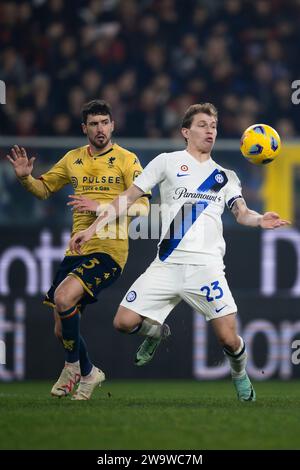 AAron Martin of Genoa CFC competes for the ball with Roberto ...