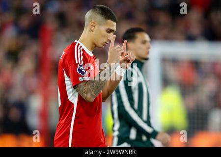 Nicolas Dominguez of Nottingham Forest takes a knock during the Premier ...