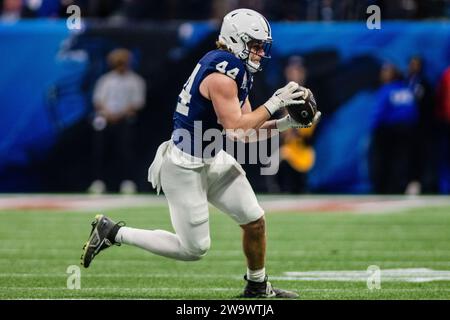 Penn State tight end Tyler Warren (44) is tackled by SMU linebacker ...