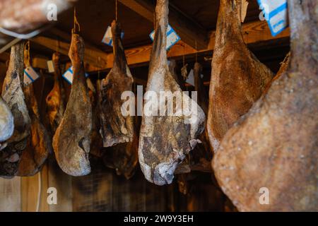 Aging hams hanging in a traditional curing room Stock Photo - Alamy