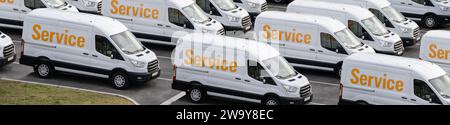 Vans are parked in row. Commercial fleet Stock Photo - Alamy