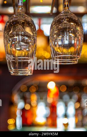 Glasses hanging up at a bar, with a shallow depth of field Stock Photo ...