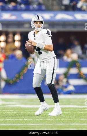 Las Vegas Raiders quarterback Aidan O'Connell (12) rolls out against ...