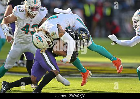 Baltimore Ravens running back Justice Hill (43) works out before an NFL ...
