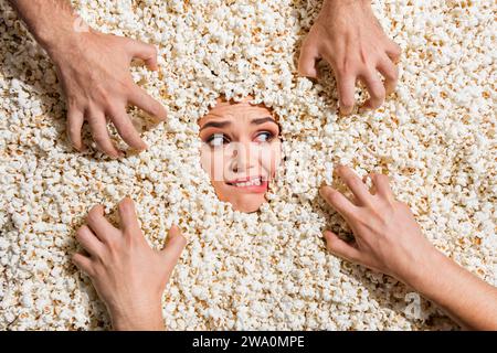 Top view photo of terrified crazy person biting lips watch scary movie ...