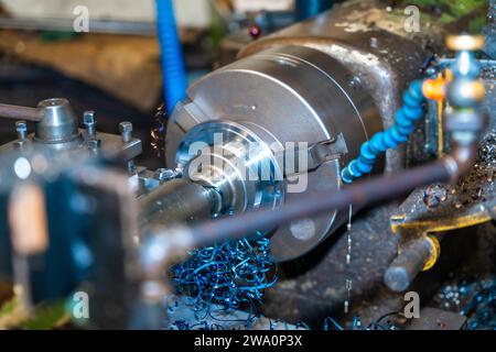 The CNC milling machine cuts metal parts with a milling machine and ...