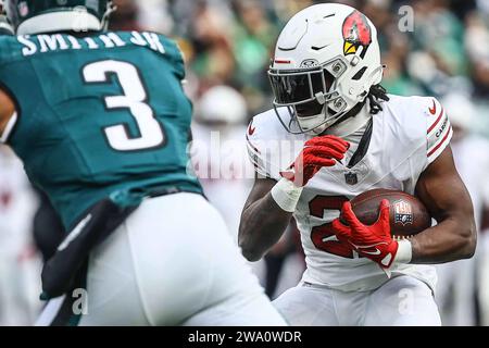 Arizona Cardinals running back Michael Carter (22) is tackled by ...