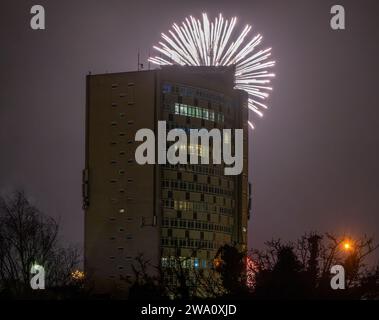 Merton, London, UK. 1st Jan, 2024. New Years Day fireworks burst around ...