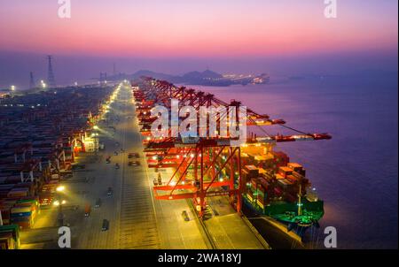 A cargo ship carries out container handling operations at the container ...