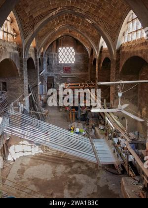 Machine and equipment in the weaving shop. interior of industrial ...