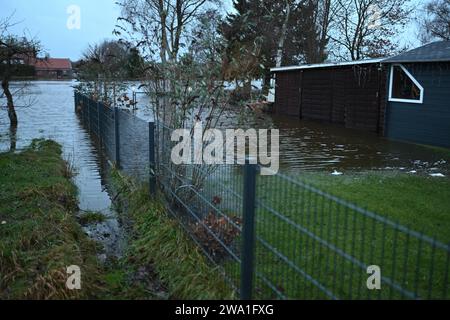 Haren, Germany. 01st Jan, 2024. A dyke on the Ems is secured with ...