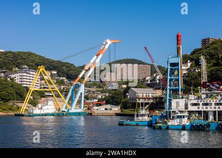 Shipyards within Nagasaki bay Japan, industrial landscape shore harbour ...