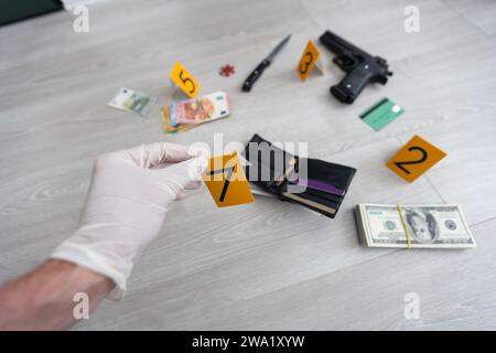 Crime scene investigation - collecting bullet of pistol on the ground ...
