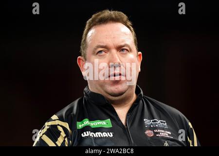 Brendan Dolan in action against Luke Littler (not pictured) on day ...