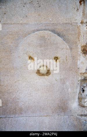 "Ghost" snowman as marks left by fittings removed from a stone wall ...