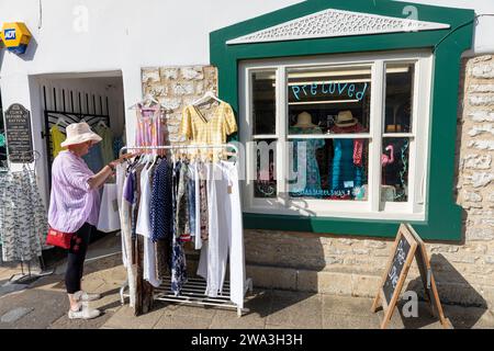 Woman model released browsing recycled clothes at a pre loved clothing ...