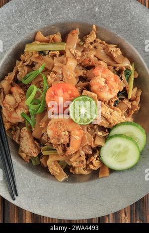 Kwetiau goreng is Chinese Indonesian stir fried flat rice noodle dish ...