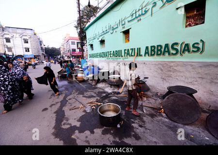 A cook cooking biryanis in a large communal cooking space during the ...