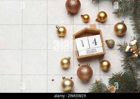 Calendar with text 14 DAYS UNTIL HOLIDAYS and Christmas decor on grey ...