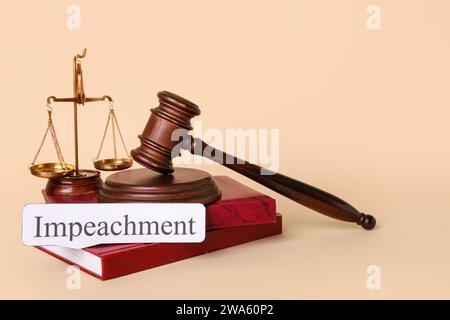 Word IMPEACHMENT, judge gavel, scales of justice and law books on beige ...