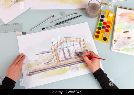 Architect illustrator working on hand drawn illustration of a modular ...