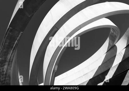 Striking monochrome architectural feature with sweeping curves and a ...