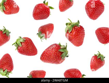 Fresh ripe strawberries falling on white background Stock Photo - Alamy