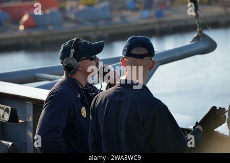 US Navy Watch standers in flight deck control monitor the position and ...