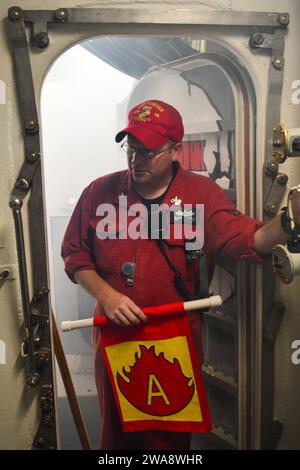 US Navy Damage Control Technician 1ST Class Jeffrey Reynolds assist ...