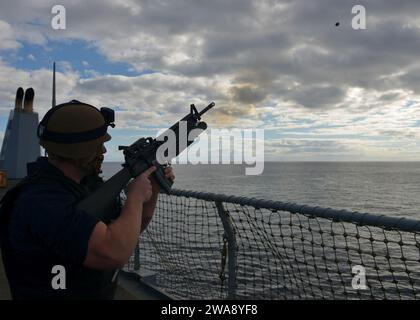 Gunner’s Mate 1st Class Adrian Rodziewicz fires an M203 grenade ...