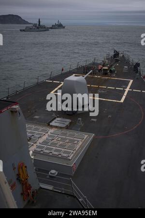 The USS Ross (DDG 71) is pictured performing a passing exercise with ...