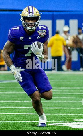 Washington running back Dillon Johnson, middle, is tackled by Stanford ...