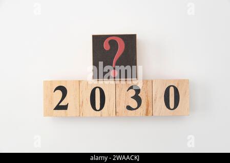Number 2030 and question mark written on wooden blocks isolated on ...
