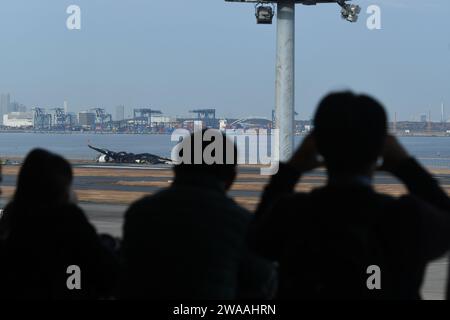 Tokyo, Japan. 3rd Jan, 2024. Stranded passengers are pictured after an ...