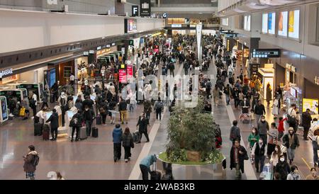 Tokyo, Japan. 03rd Jan, 2024. An ANA plane taxis as officials ...