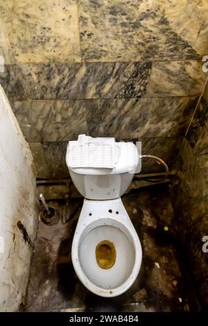 Bathroom toilet arrangement typical for public restrooms in the Soviet ...