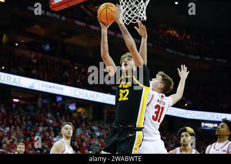Iowa forward Owen Freeman (32) dunks the ball during the first half of ...
