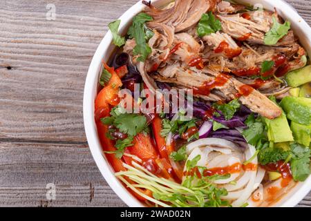 Delicious pulled pork loaded ramen bowl dish closeup with veggies Stock ...