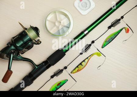 flat lay with fishing tackle, fishing rod and plastic box with fishing ...