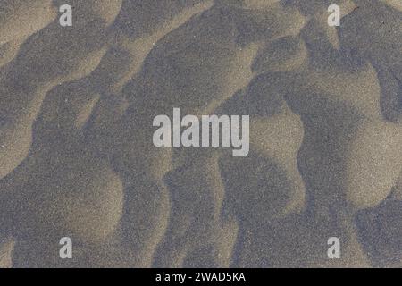 Wind sculpted patterns in beach sand Stock Photo - Alamy