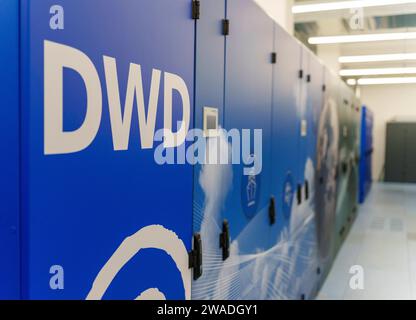 Offenbach, Germany. 21st Dec, 2023. A DWD employee sits in front of his ...