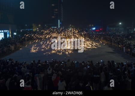A traditional iron spraying known as Datiehua is staged in Yuyao City ...
