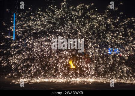 A traditional iron spraying known as Datiehua is staged in Yuyao City ...